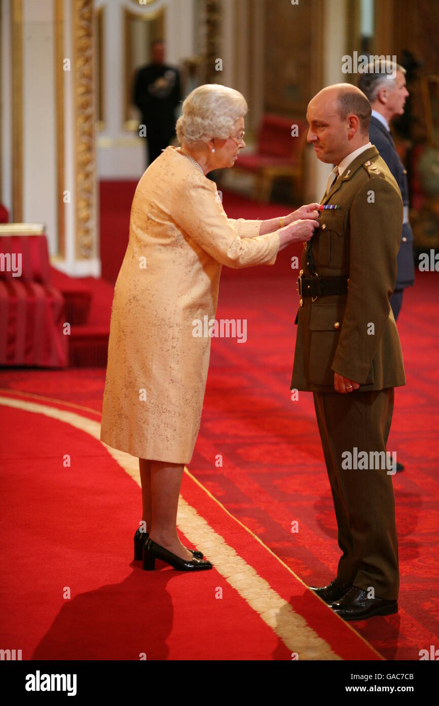 Receives an obe from the queen at buckingham palace hi-res stock ...