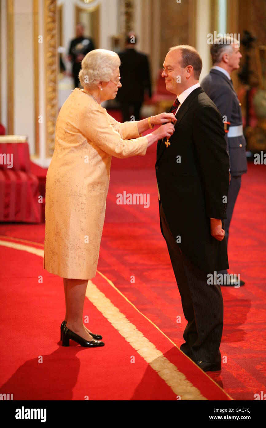 Mr. Adrian Dwyer, receives an OBE from The Queen at Buckingham Palace ...