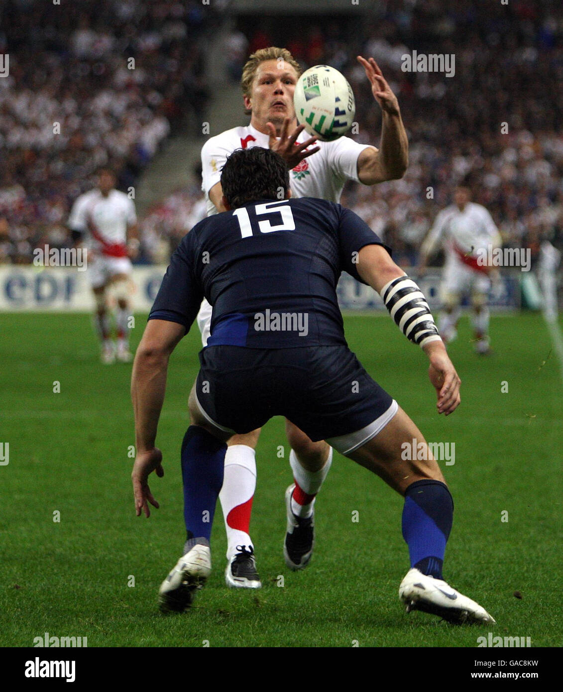Josh Lewsey collects the ball before France's damien Traille to score ...