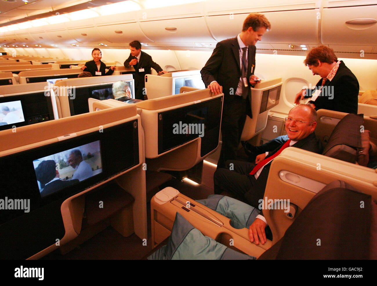 Members of the press are shown the business class section aboard the ...