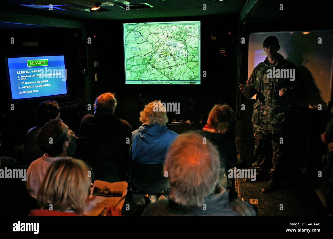A soldier speaks to the visiting media in a mobile control room at ...