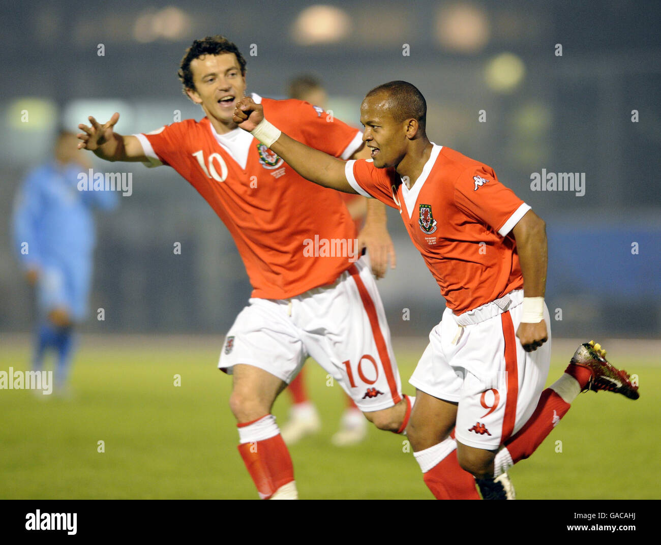 Wales Robert Earnshaw (right) celebrates his goal with Simon Davies ...