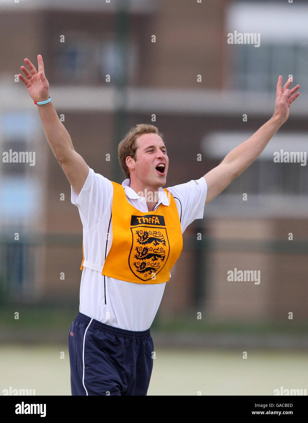 Prince William plays football alongside youngsters during a visit to ...