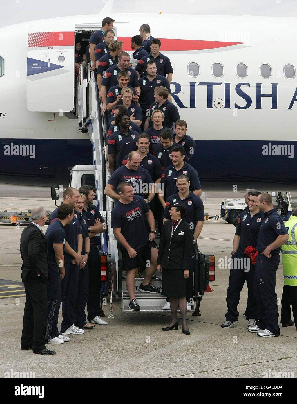 England's rugby union team line up on the steps of their British ...