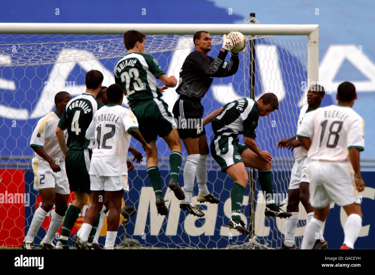 South Africa goalkeeper Andre Arendse (c) jumps to claim the ball ...