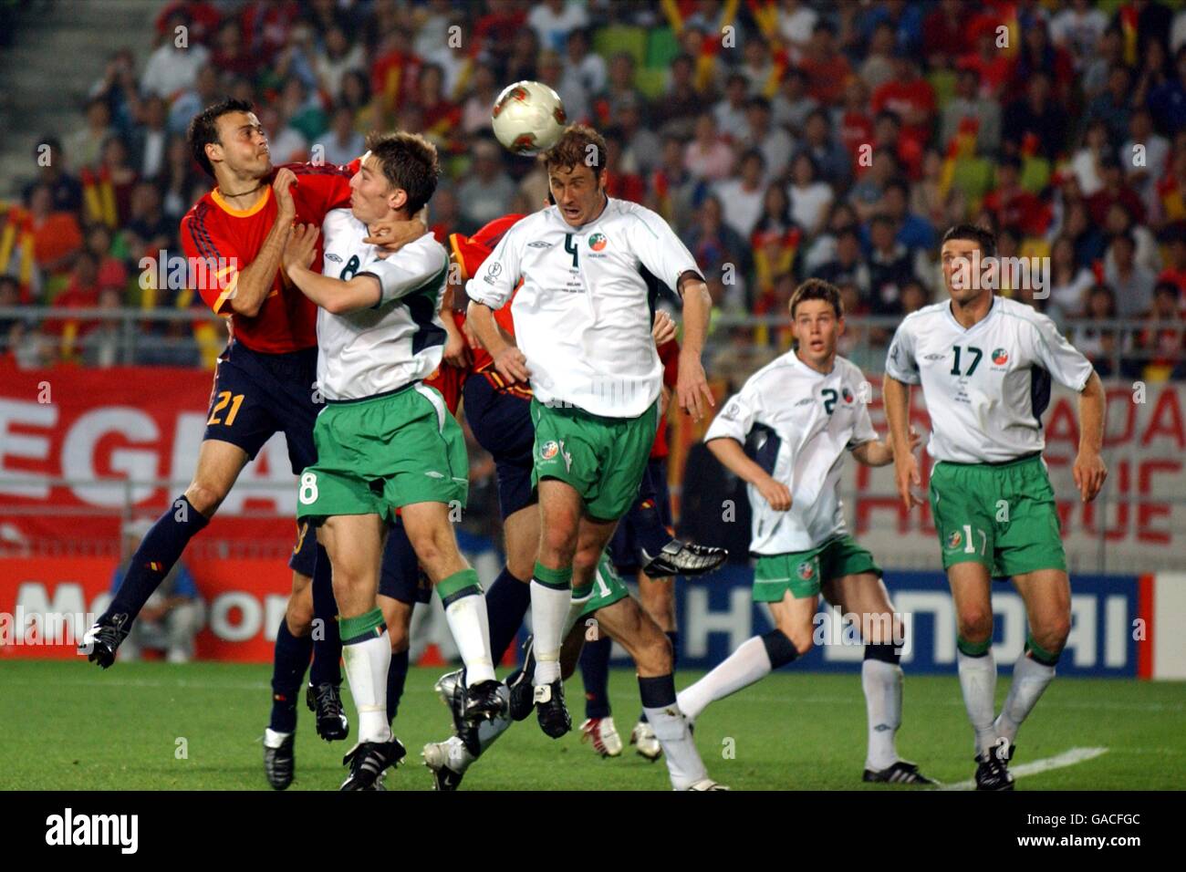 (L-R) Spain's Manuel Luis Enrique is outnumbered by Ireland's Matt ...