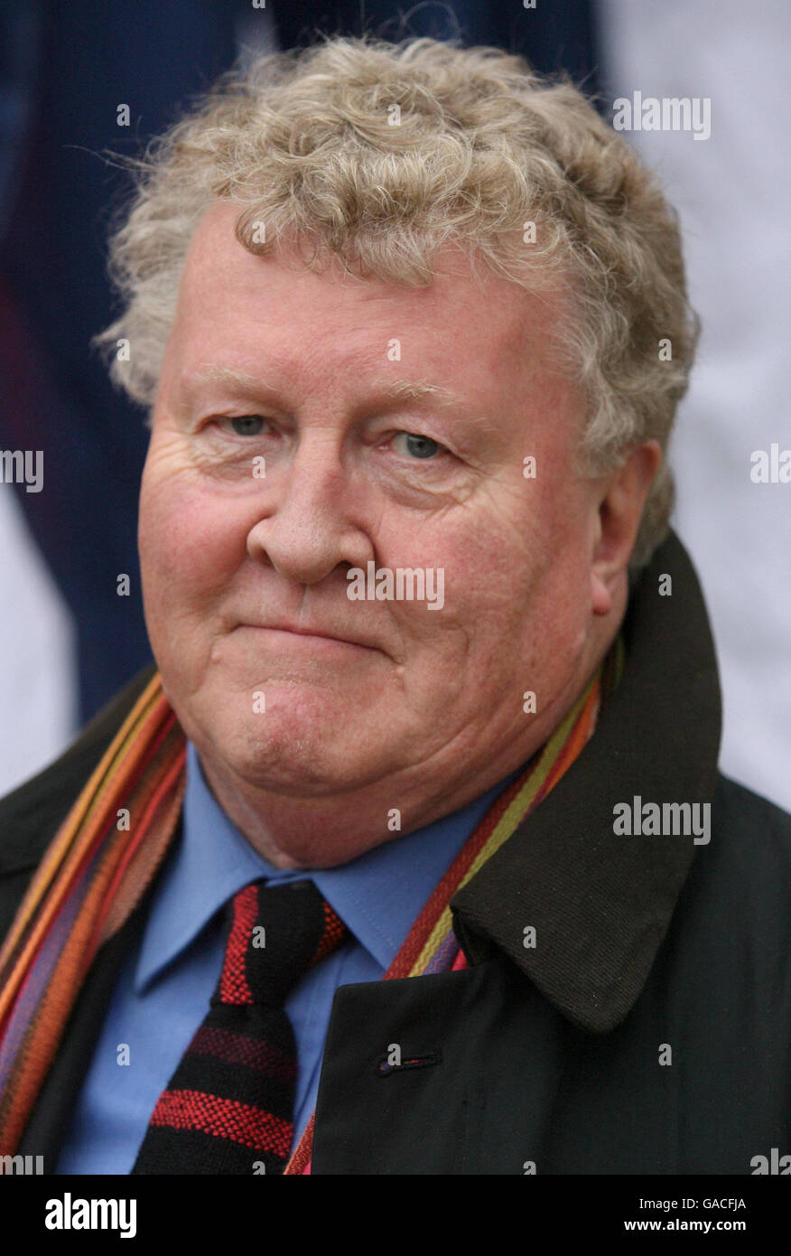Professor Glynn Williams stands proudly shortly before the unveiling by ...