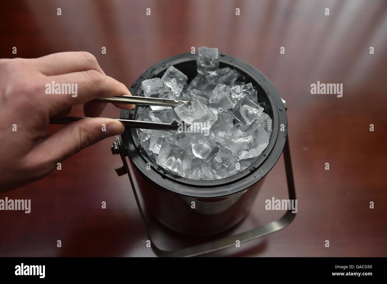 Hand in a bucket of ice water hi-res stock photography and images - Alamy