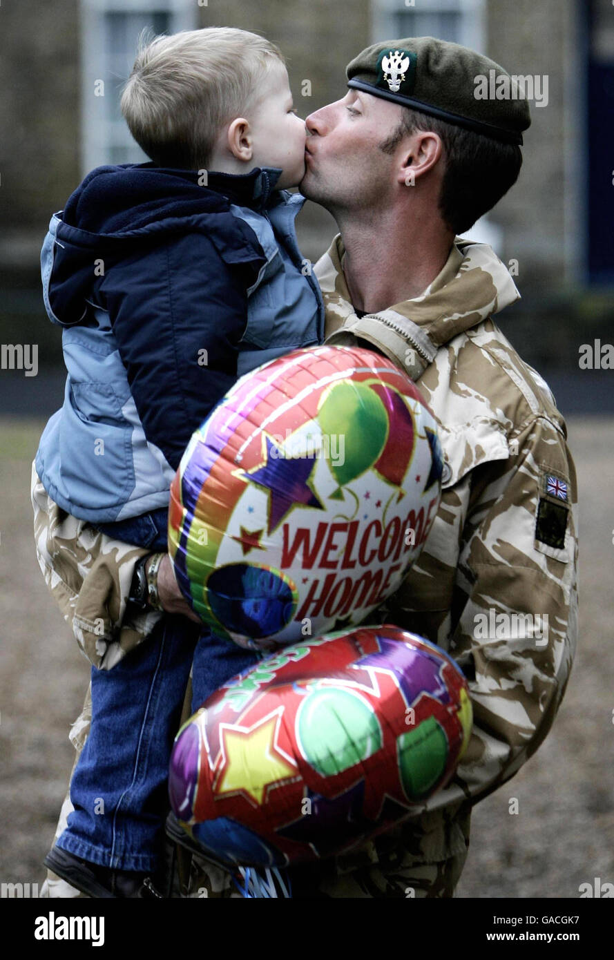Sgt Major Jason Peach kisses his son Joseph, 2, as troops from 2nd ...