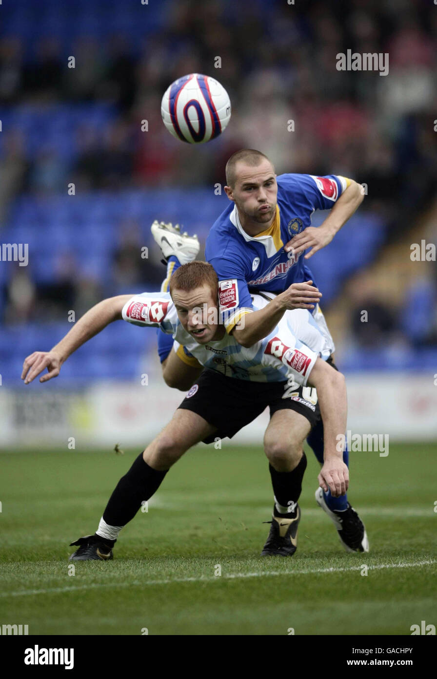 Shrewsbury's Ben Herd (top) and Chesterfield's Adam Rooney compete for ...