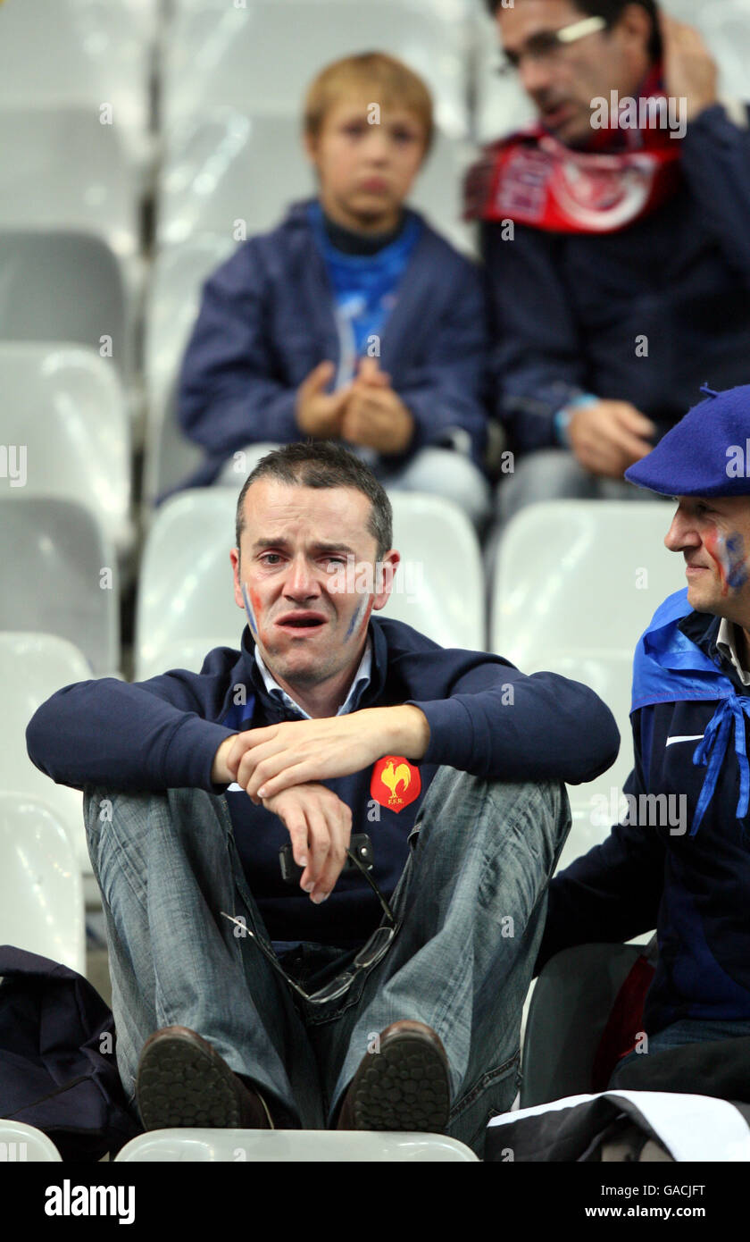 A dejected France fan is dejected at the final whistle Stock Photo - Alamy