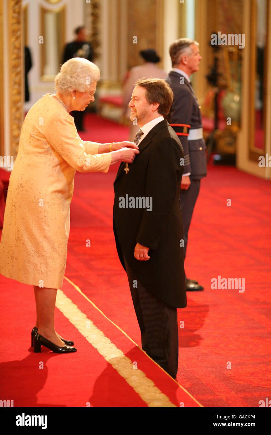 Mr. Gerald Anketell receives an MBE from The Queen at Buckingham Palace ...
