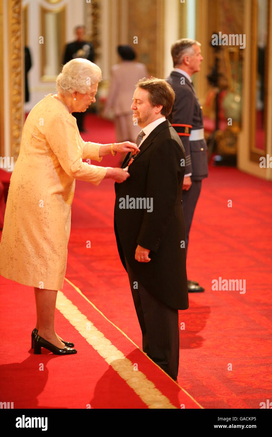 Mr. Gerald Anketell receives an MBE from The Queen at Buckingham Palace ...