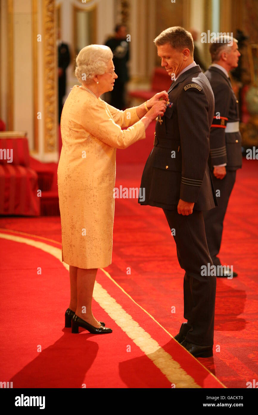 Receives an mbe from the queen at buckingham palace hi-res stock ...