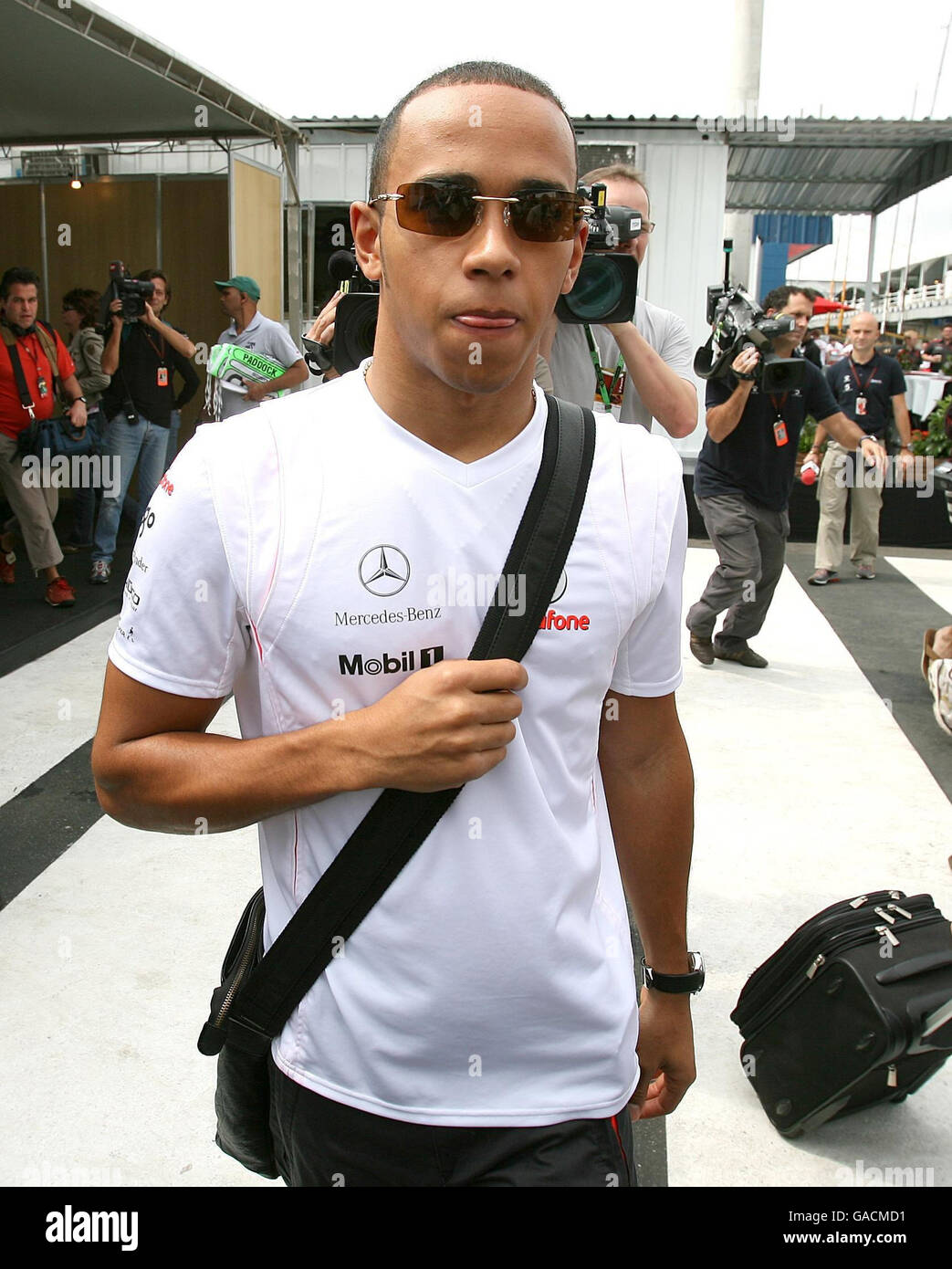 Englands lewis hamilton arrives for a press conference at interlagos hi ...