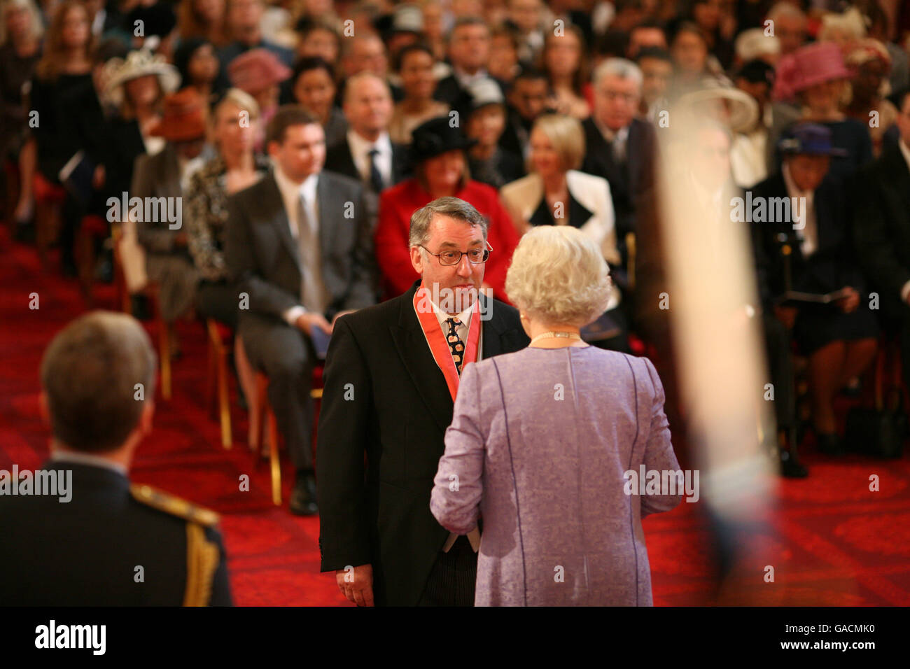 Is made a cbe by the queen at buckingham palace hi-res stock ...
