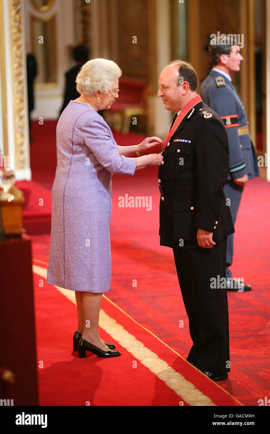 Mr. John Vine is made a CBE by The Queen at Buckingham Palace Stock ...