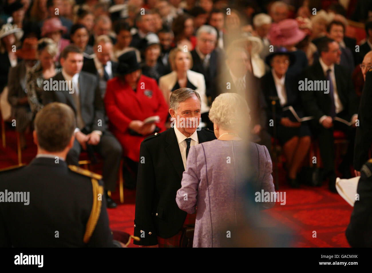 Lieutenant Colonel Ian Fraser is made an MBE by The Queen at Buckingham ...