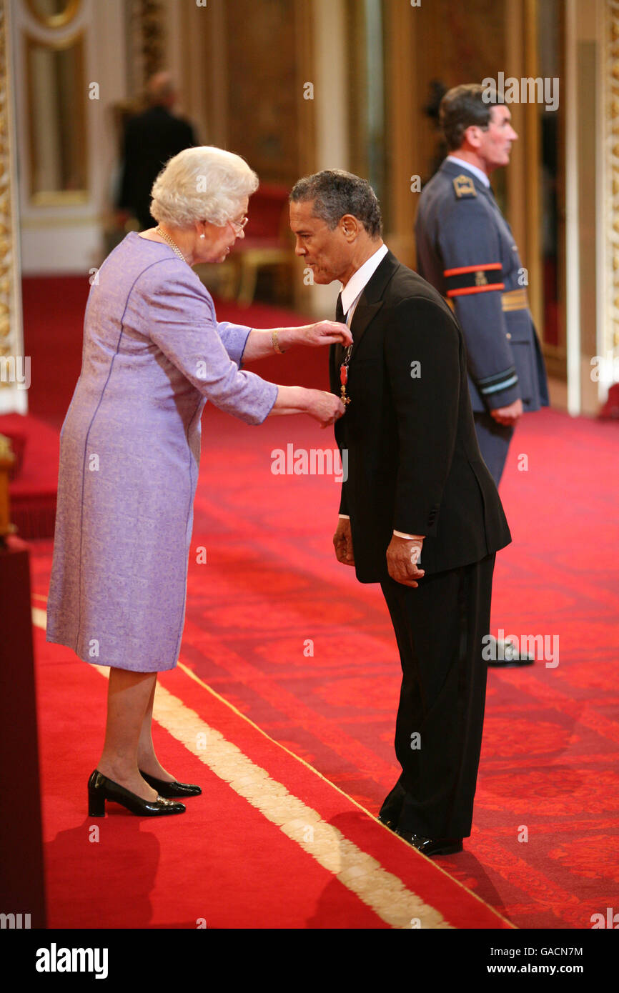 Mr. Rick Wayne is made an OBE by The Queen at Buckingham Palace Stock ...