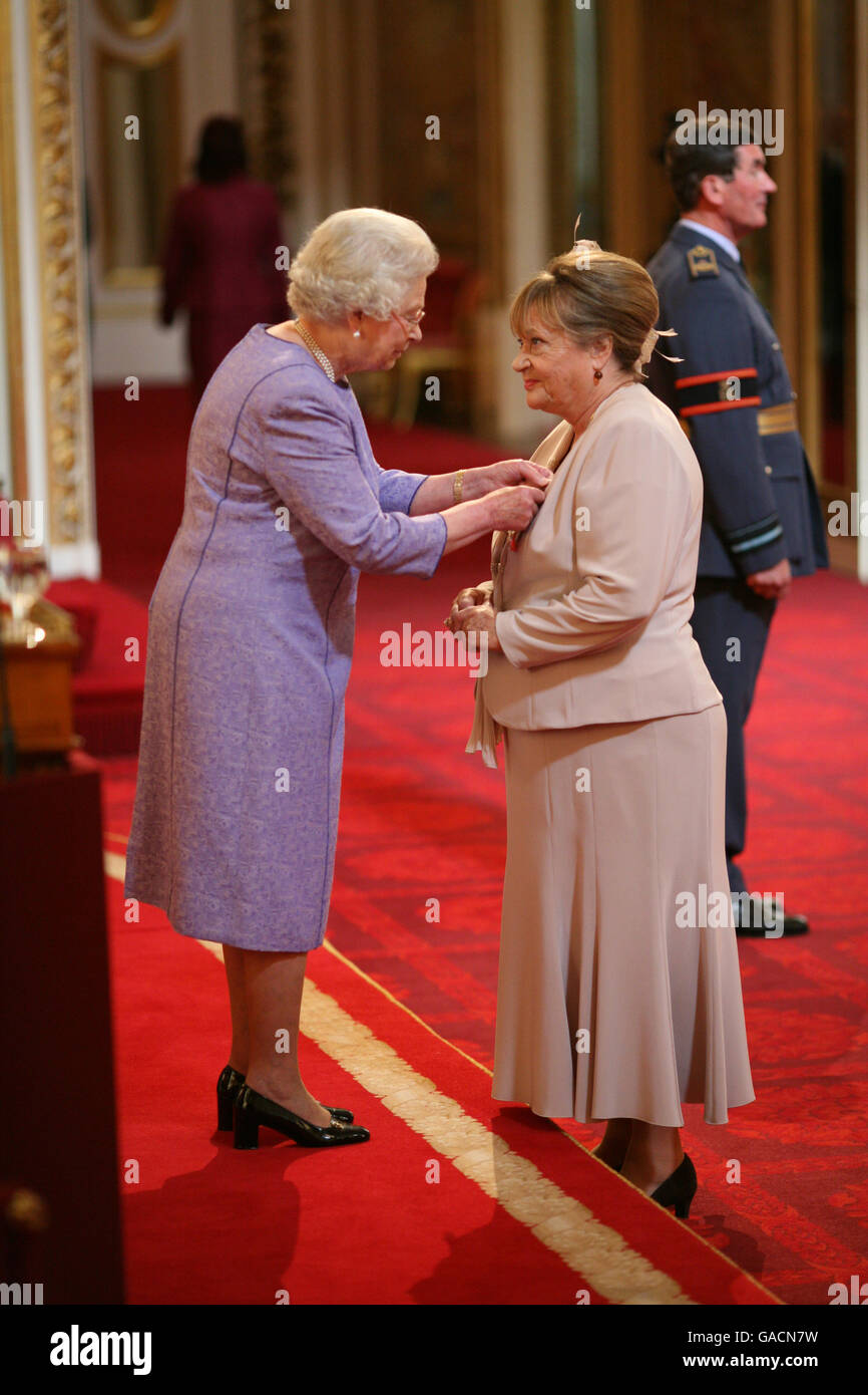 Sylvia Syms, from London, is made an OBE by The Queen at Buckingham ...