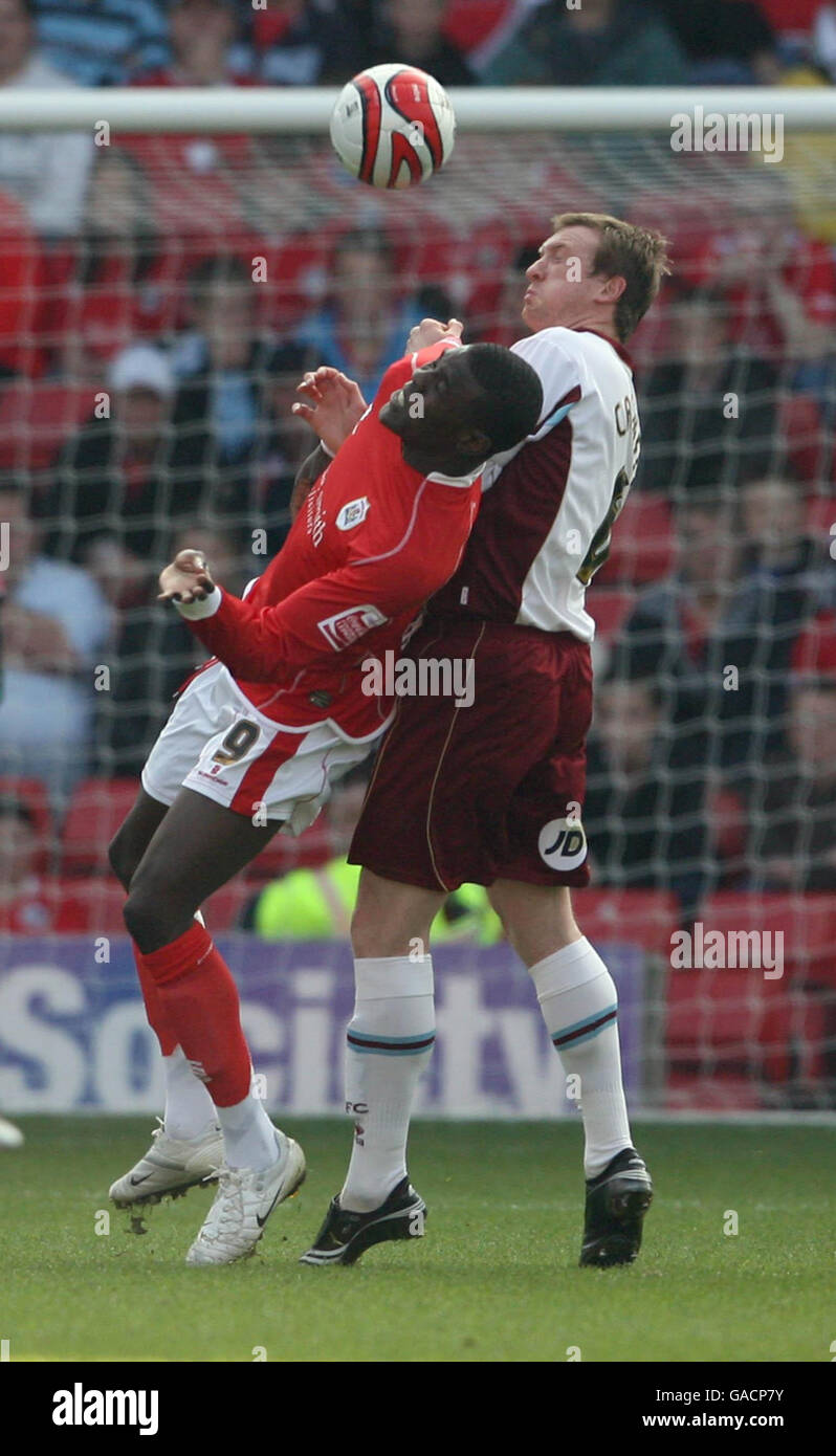 Barnsley`s Kayode Odejayi and Burnley's Steven Caldwell during the Coca ...