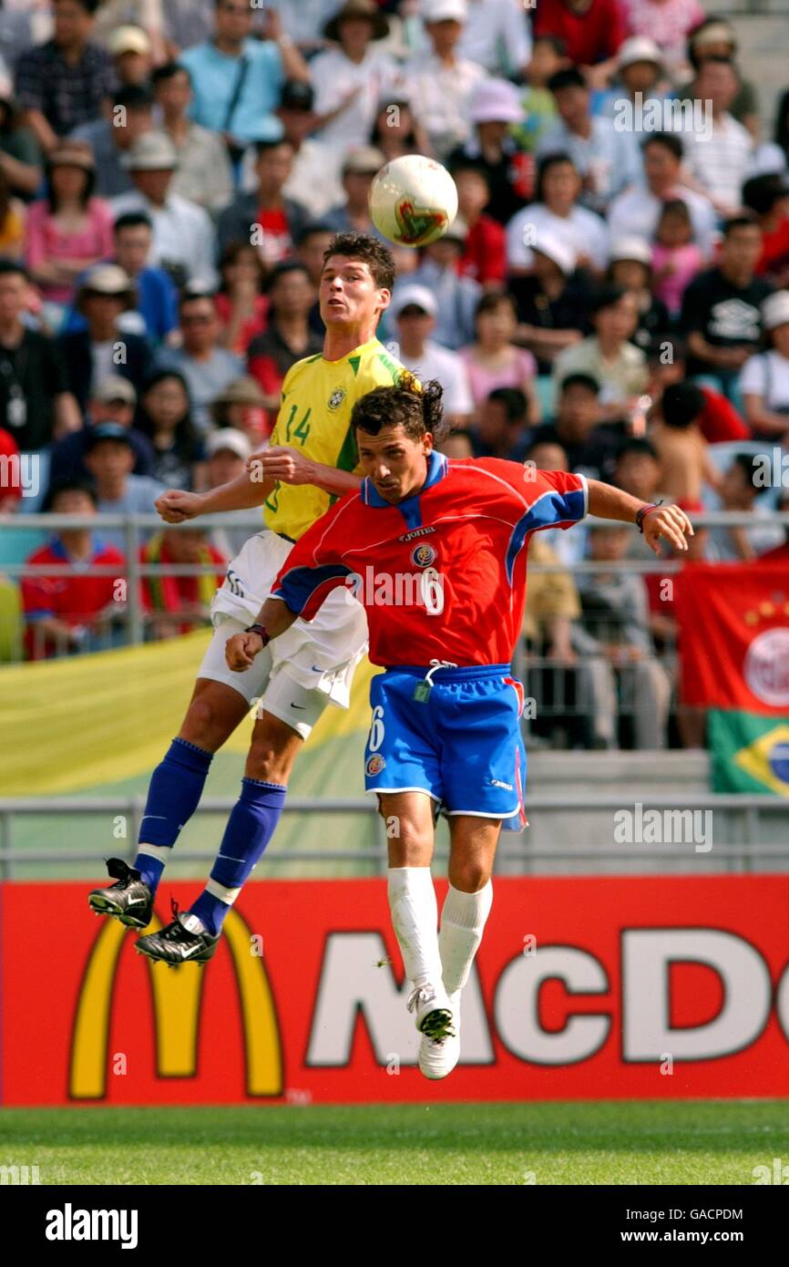 Costa Rica's Wilmer Lopez (r) jumps for a header with Brazil's Anderson ...