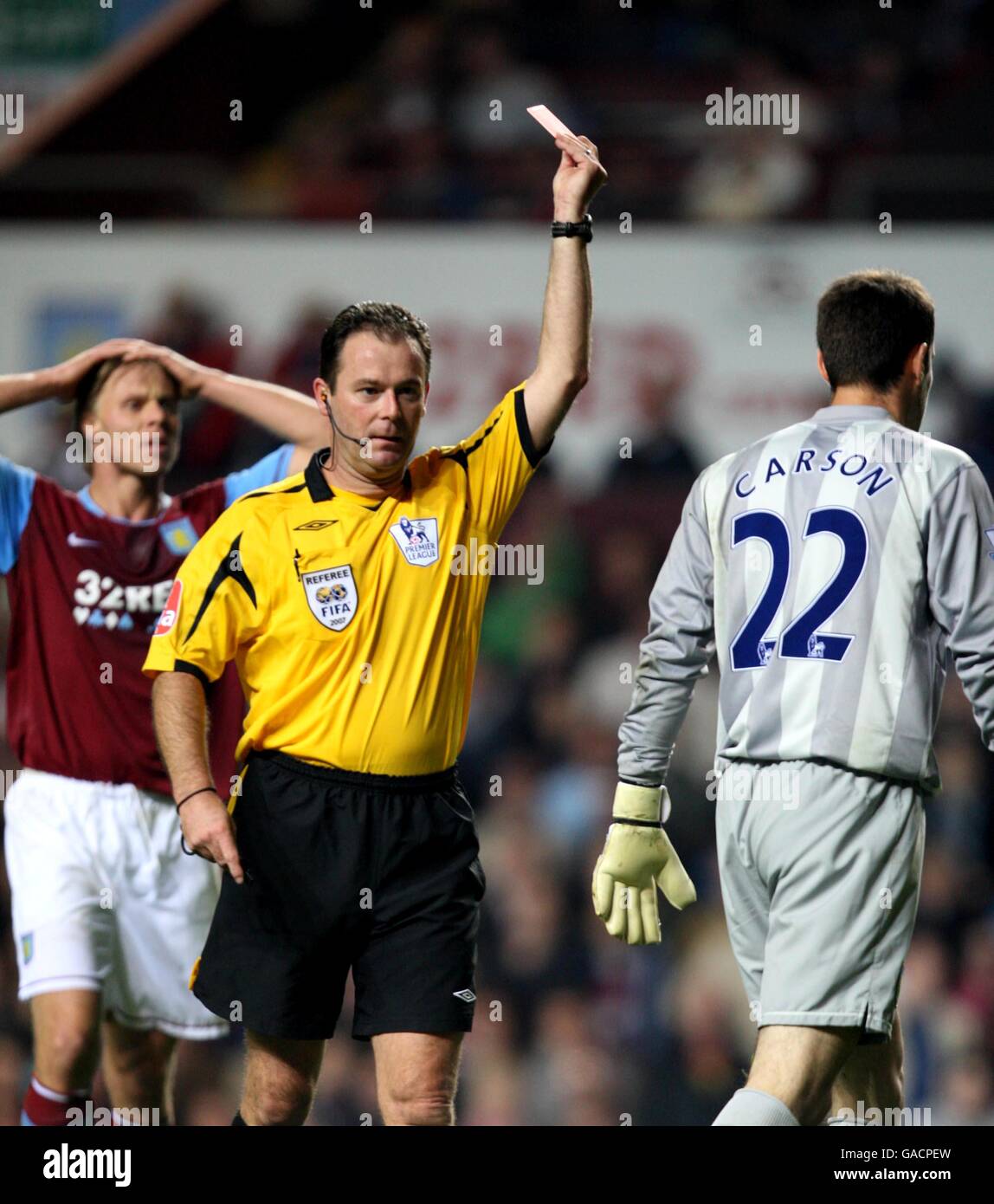 Aston Villa goalkeeper Scott Carson is shown the red card from referee ...
