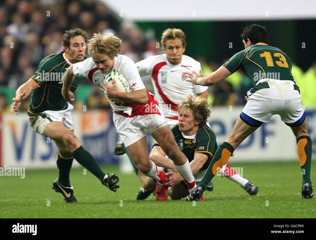 England's Matthew Tait breaks through the South African defence Stock ...