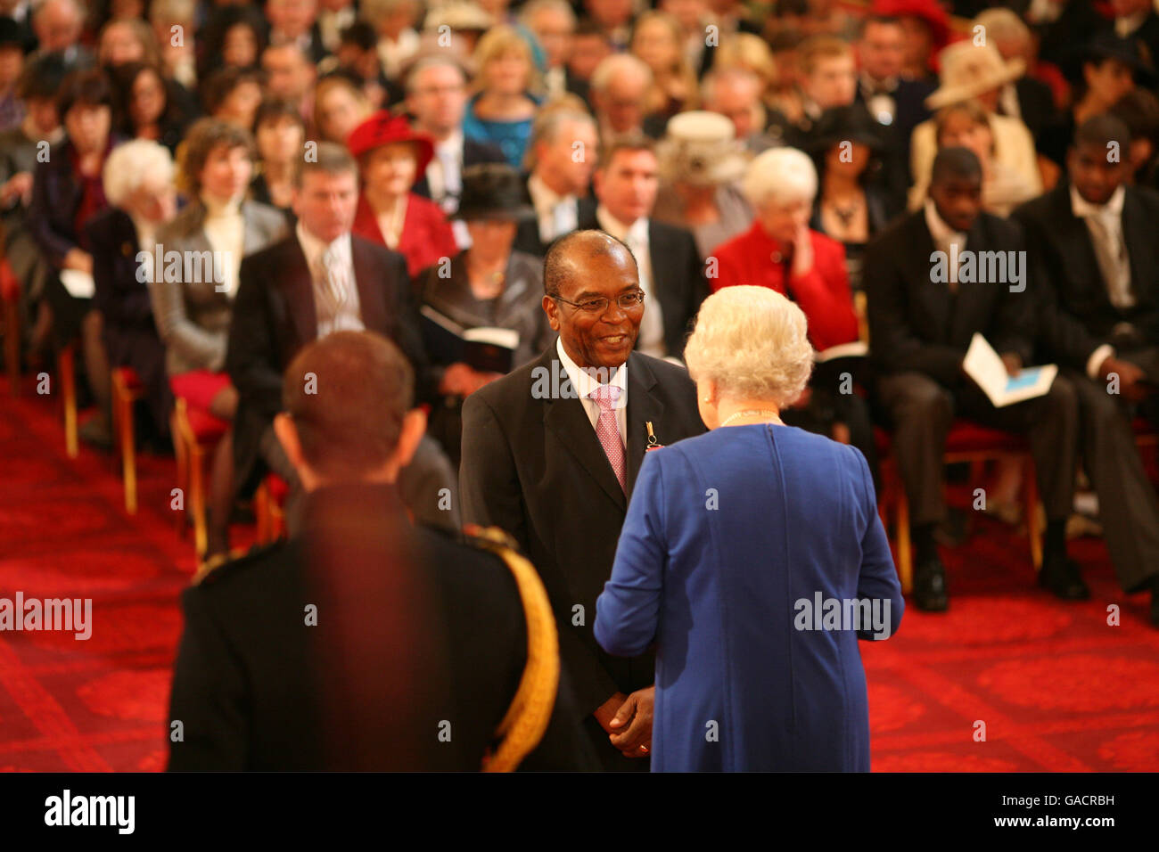 Mr. Stanfield Clarke, from Bridgend, is made an MBE by The Queen at ...