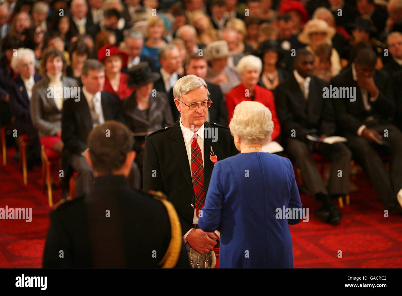 Mr. Alfred Stewart, from Dunfermline, is made an MBE by The Queen at ...