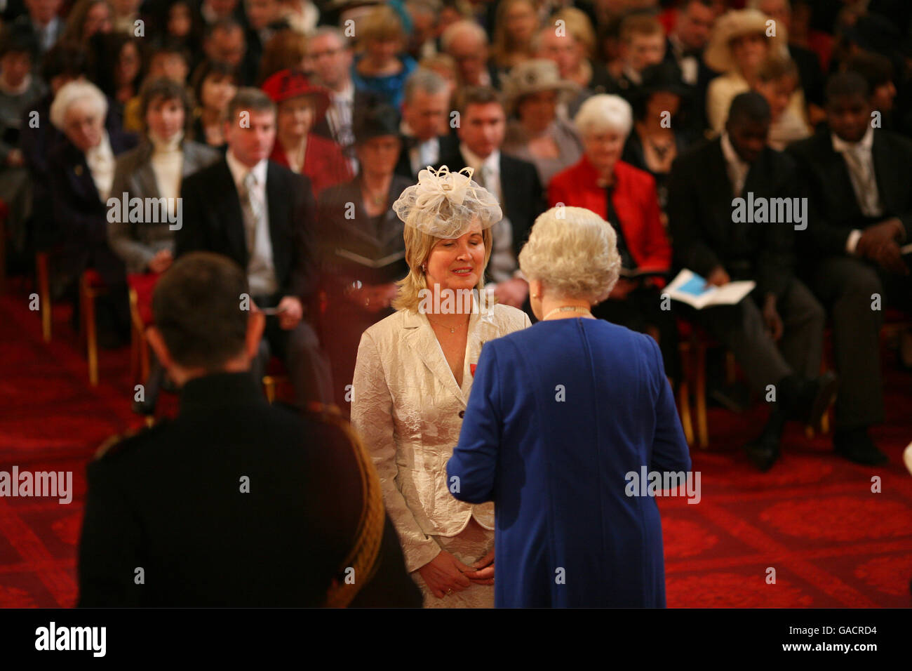 Mrs Elizabeth Aiken is made an MBE by The Queen at Buckingham Palace ...