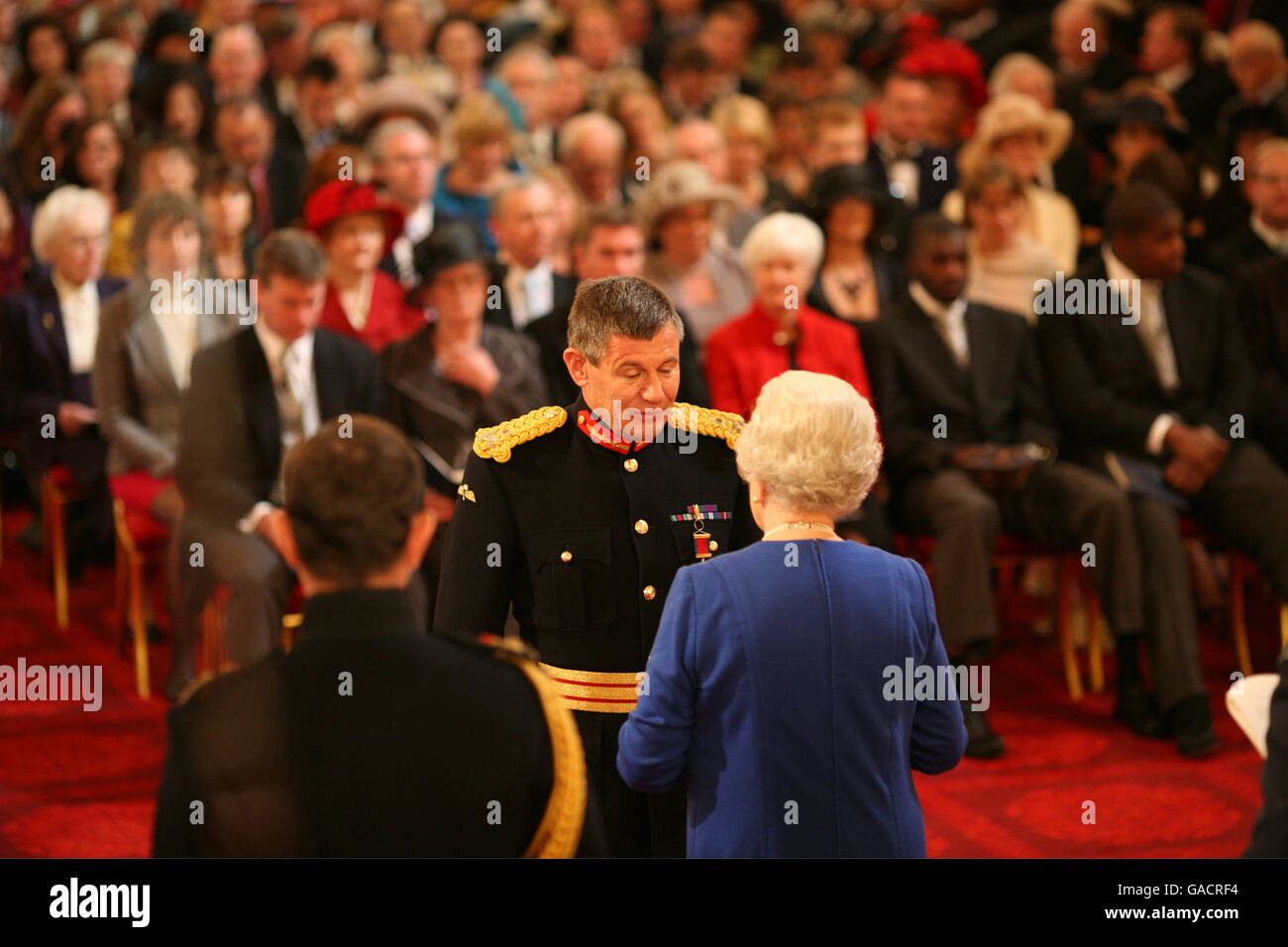 Major General Jeremy Thomas receives a DSO from The Queen at Buckingham ...
