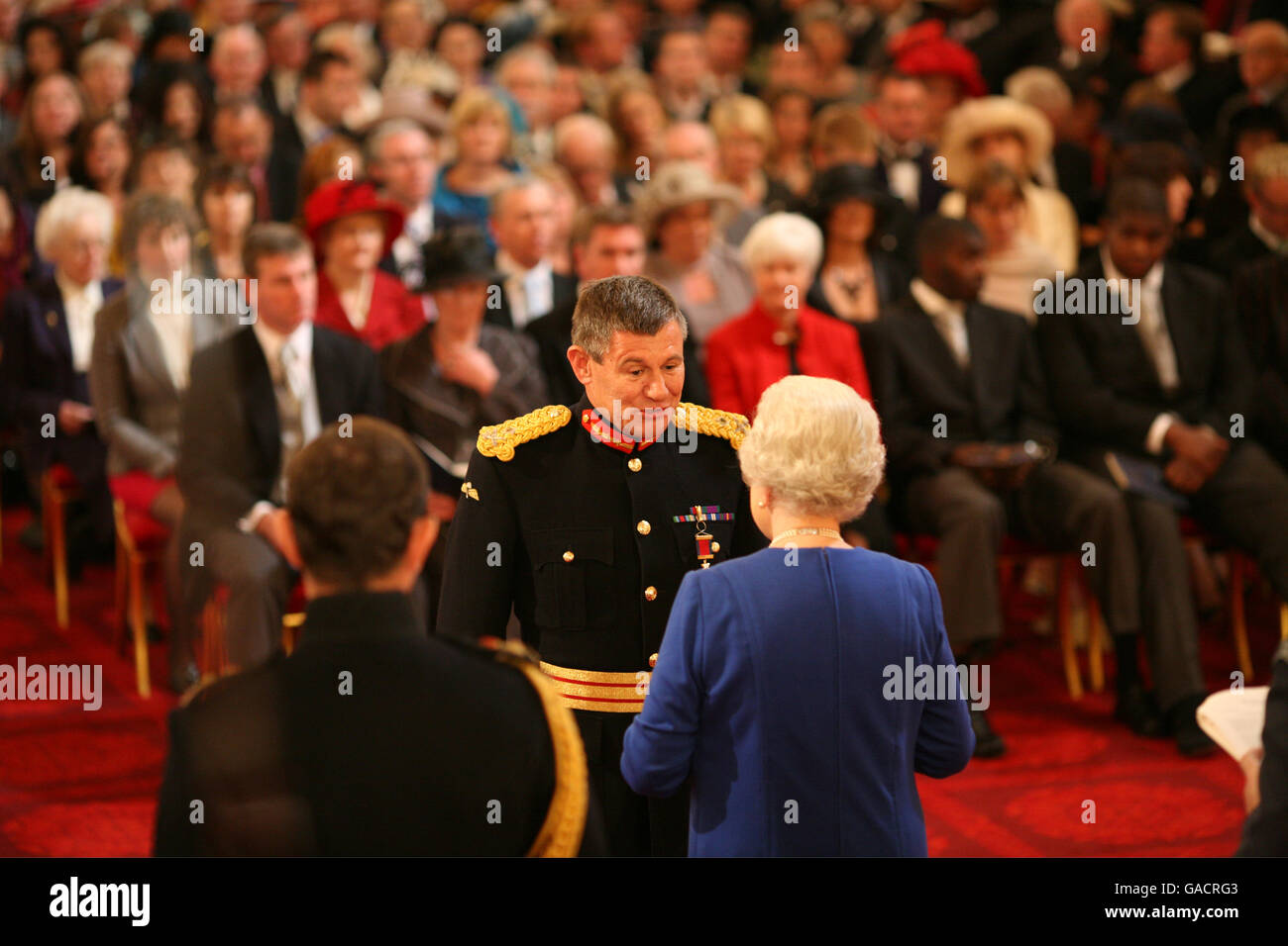 Major General Jeremy Thomas receives a DSO from The Queen at Buckingham ...