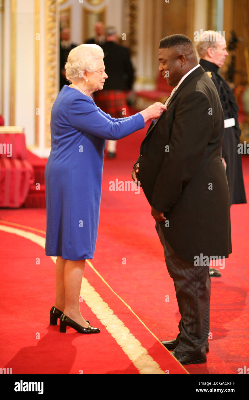 Mr. Clasford Stirling, from London, is made an MBE by The Queen at ...