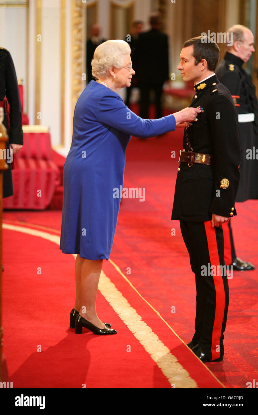Major Roland Cockwell is made an MBE by The Queen at Buckingham Palace ...