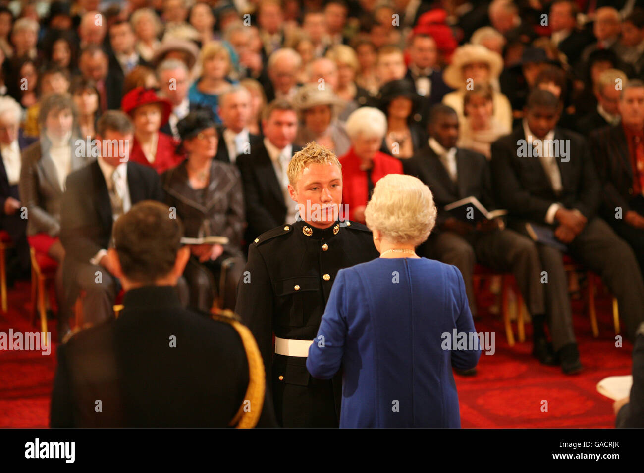 Marine Daniel Fisher receives the Military Cross from The Queen at ...