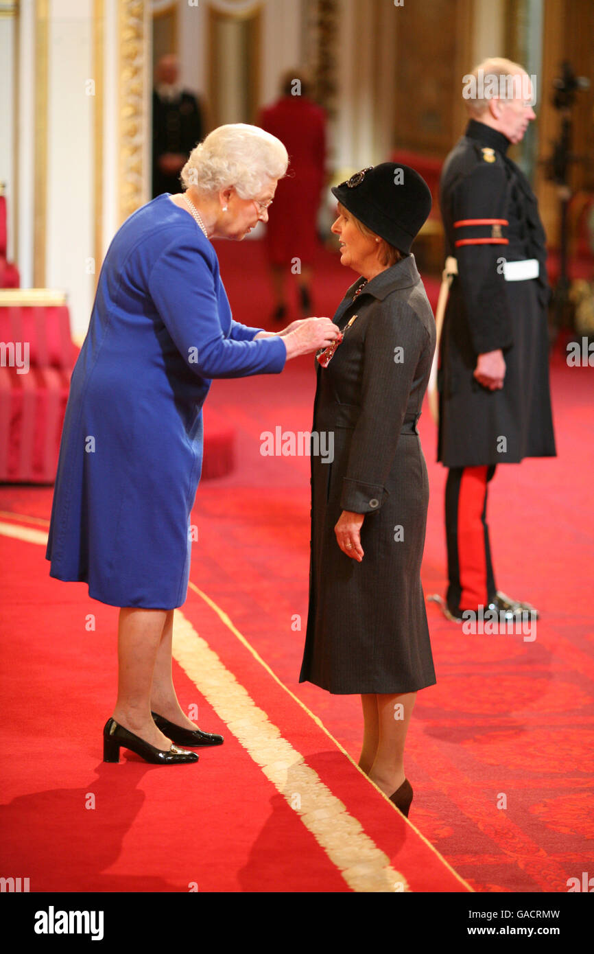 Mrs Jane Jason, from London, is made an OBE by The Queen at Buckingham ...
