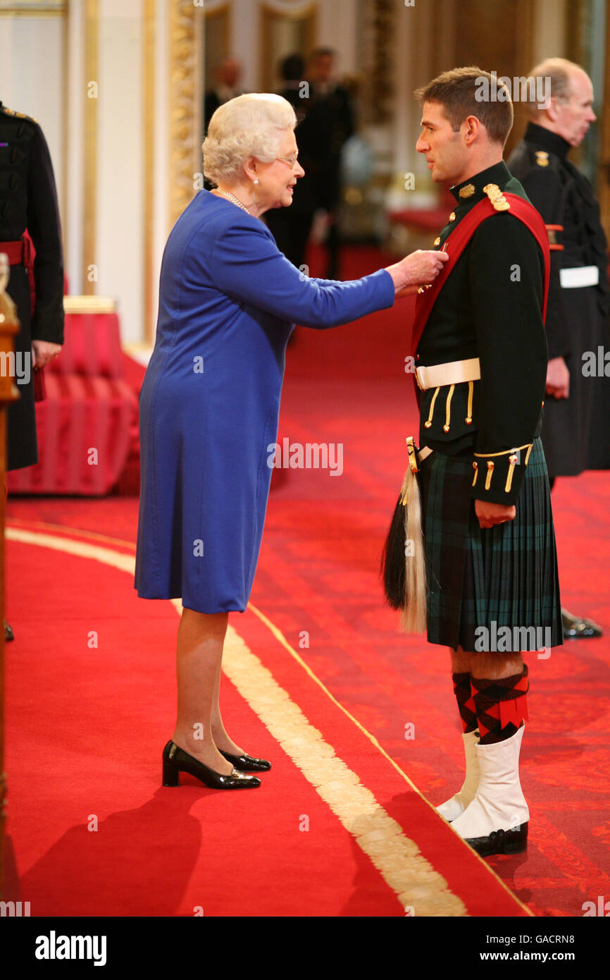 Major Derek Dobson is made an MBE by The Queen at Buckingham Palace ...