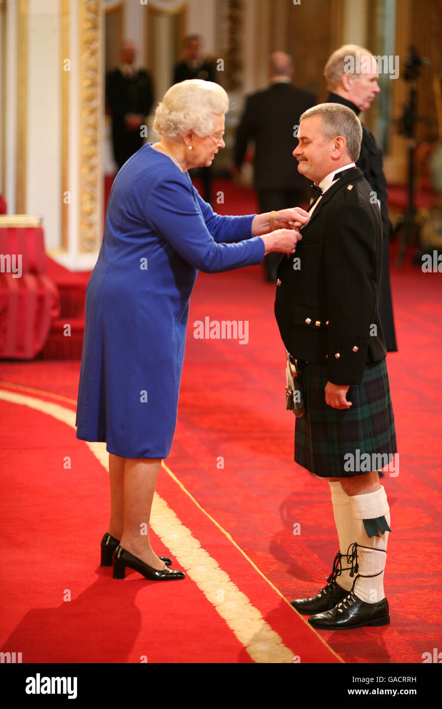 Mr. Derek Brown, from Morpeth, is made an MBE by The Queen at ...
