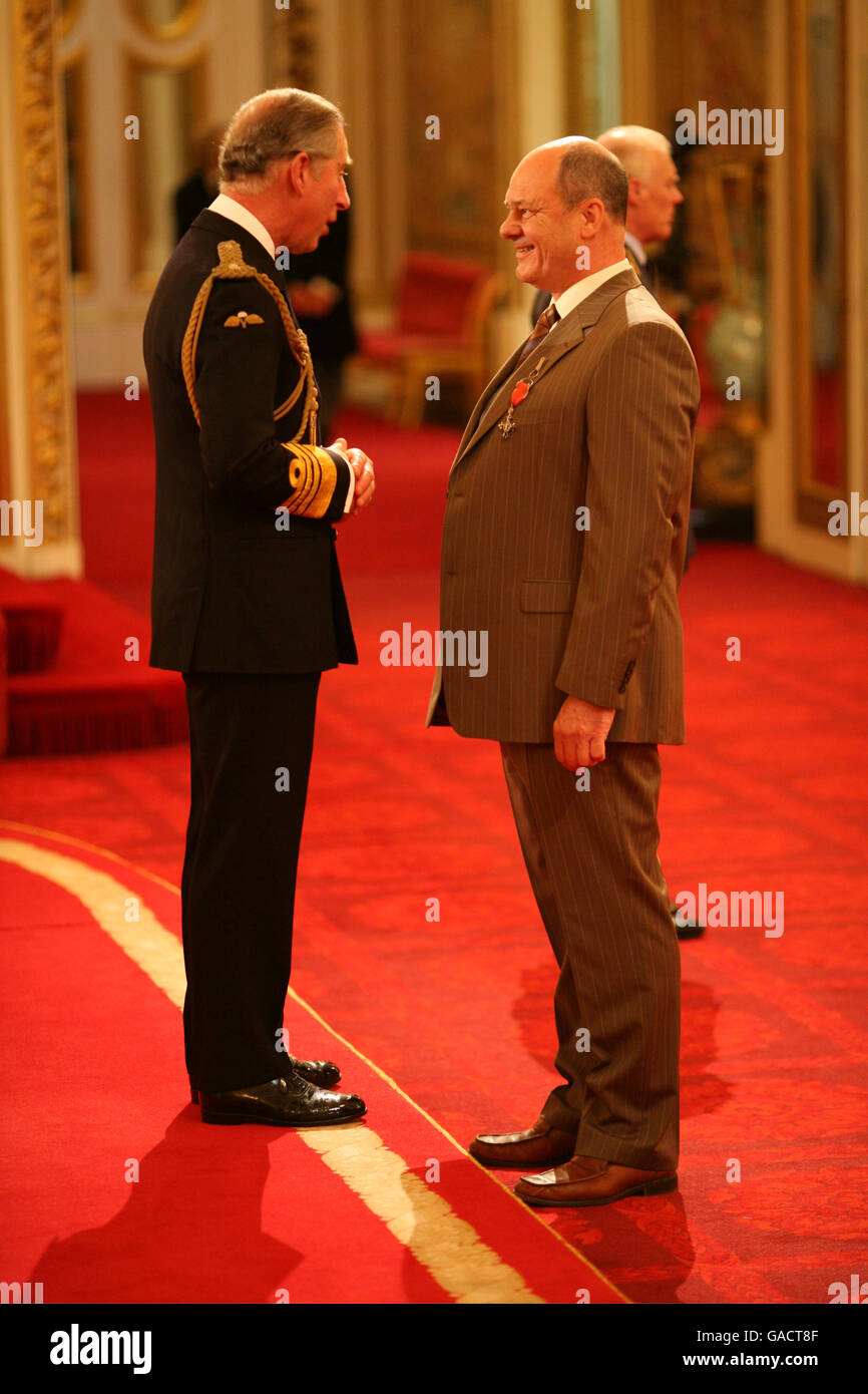 Dr. Mark Johnston is made an MBE by the Prince of Wales at Buckingham ...