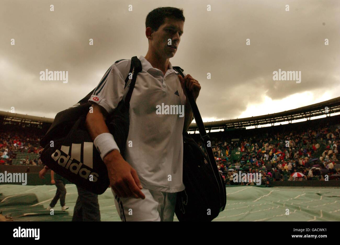 Tennis - Wimbledon 2002 - Fourth Round. Tim Henman walks off the court ...