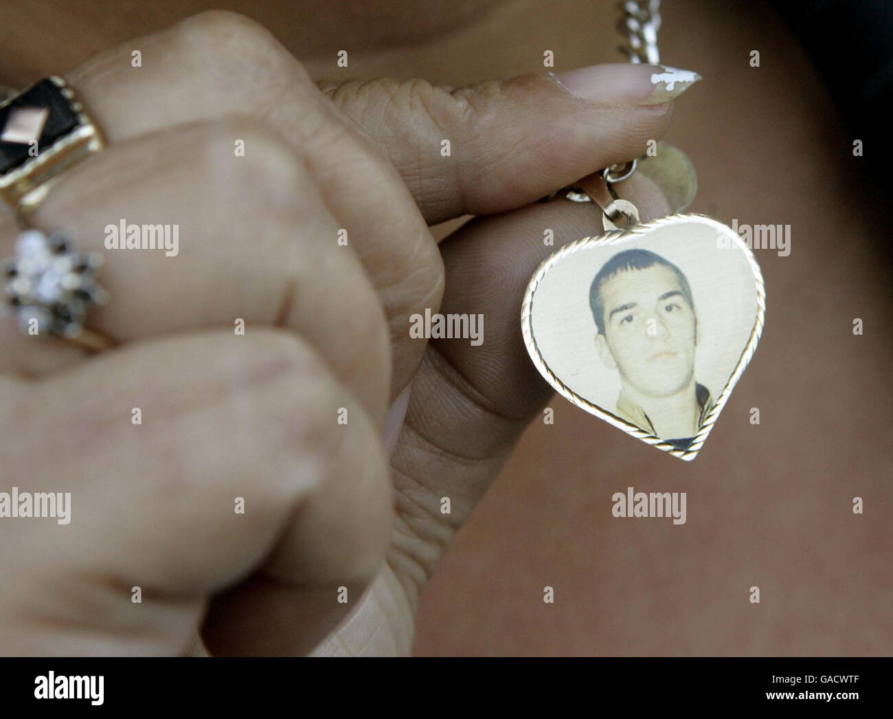 A close up of a locket worn by Rose Gentle showing a picture of her son ...