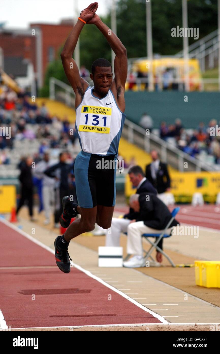 Tim Rusan in action in the men's triple jump competition Stock Photo ...