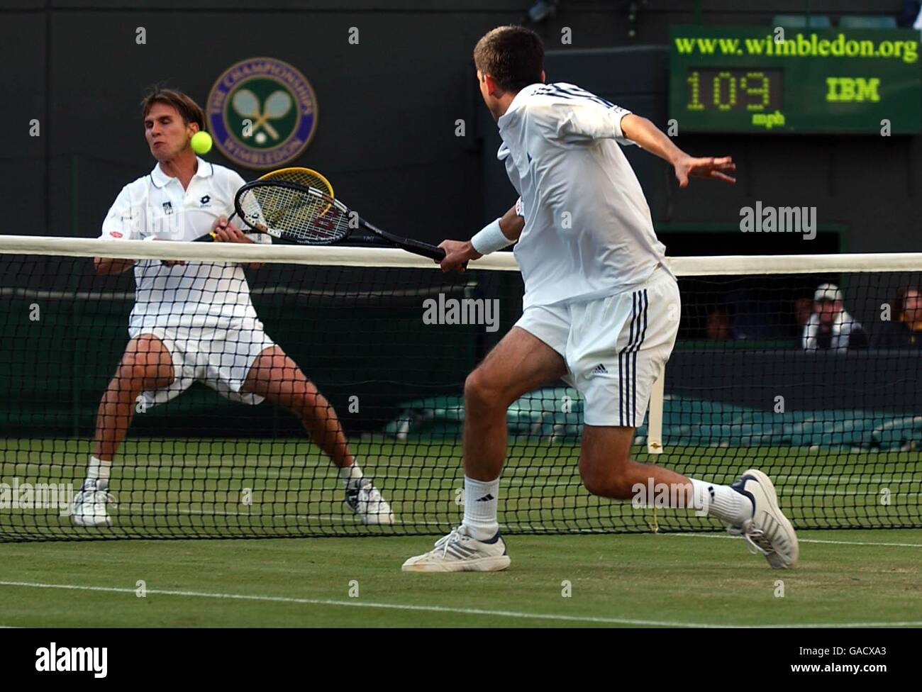 Tennis, Wimbledon 2002, Fourth Round. Tim Henman hits the ball into ...
