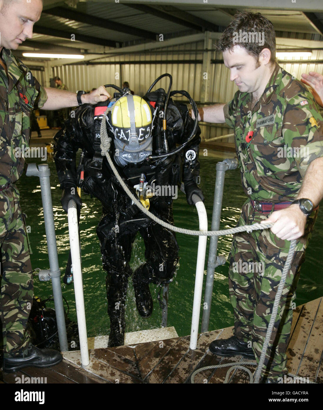 Prince Harry (centre) during his visit to the Royal Navy's fleet diving ...