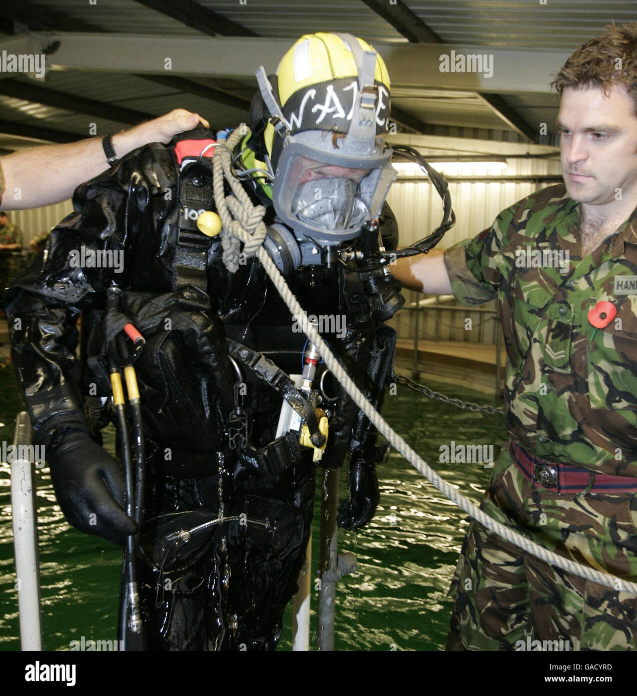 Prince Harry (left) during his visit to the Royal Navy's fleet diving ...