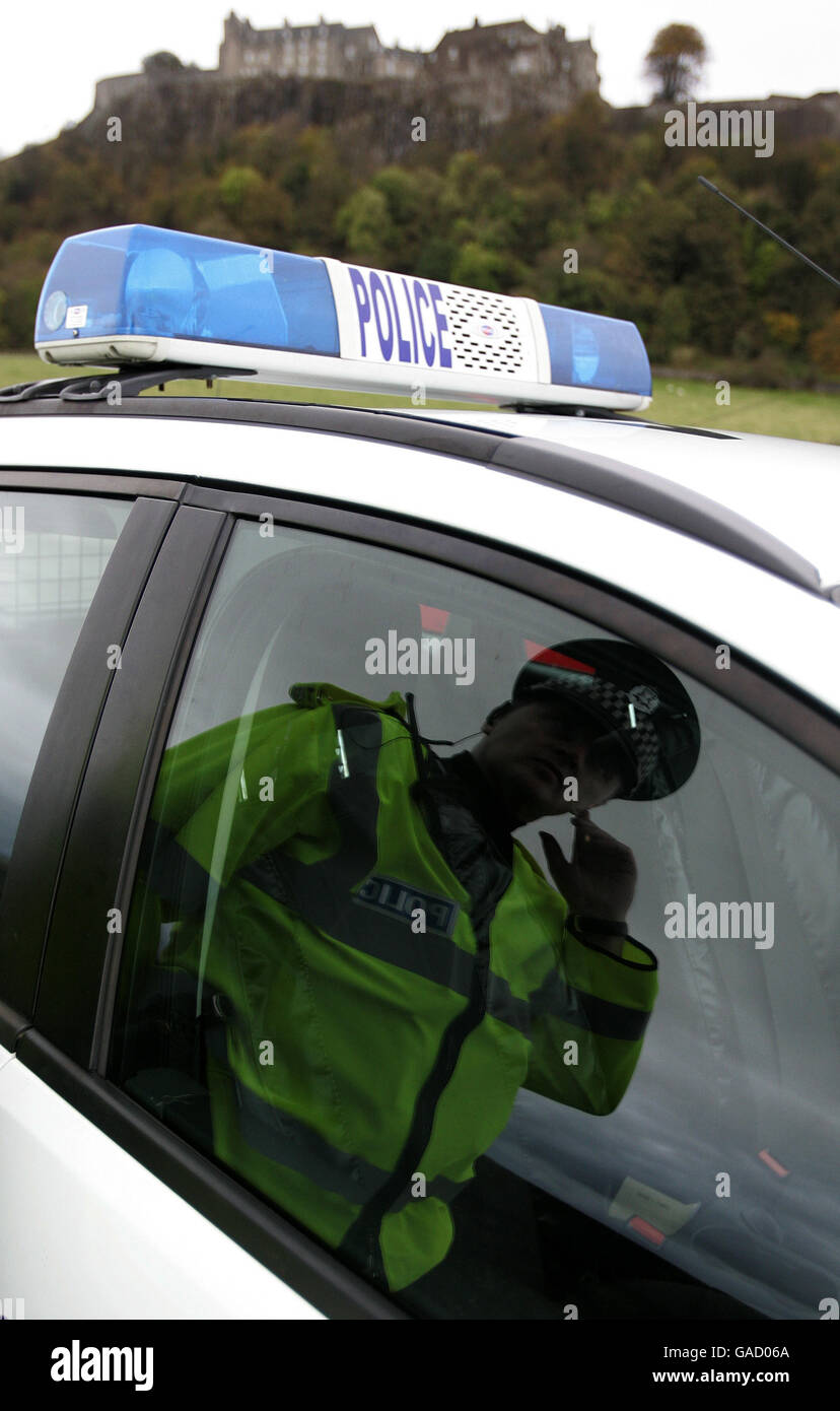 Central Scotland Police officer beside police car at Stirling Castle ...