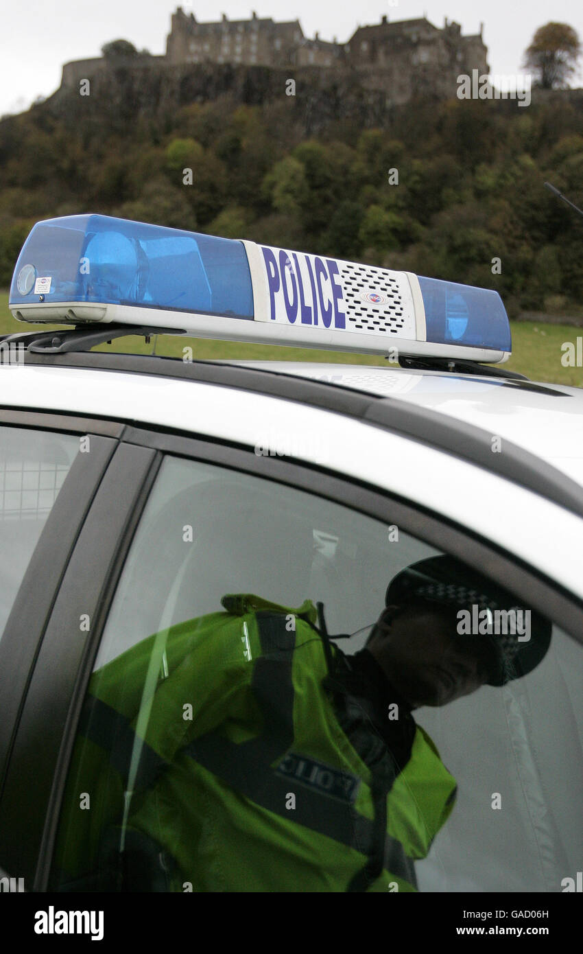 Central Scotland Police officer beside police car at Stirling Castle ...