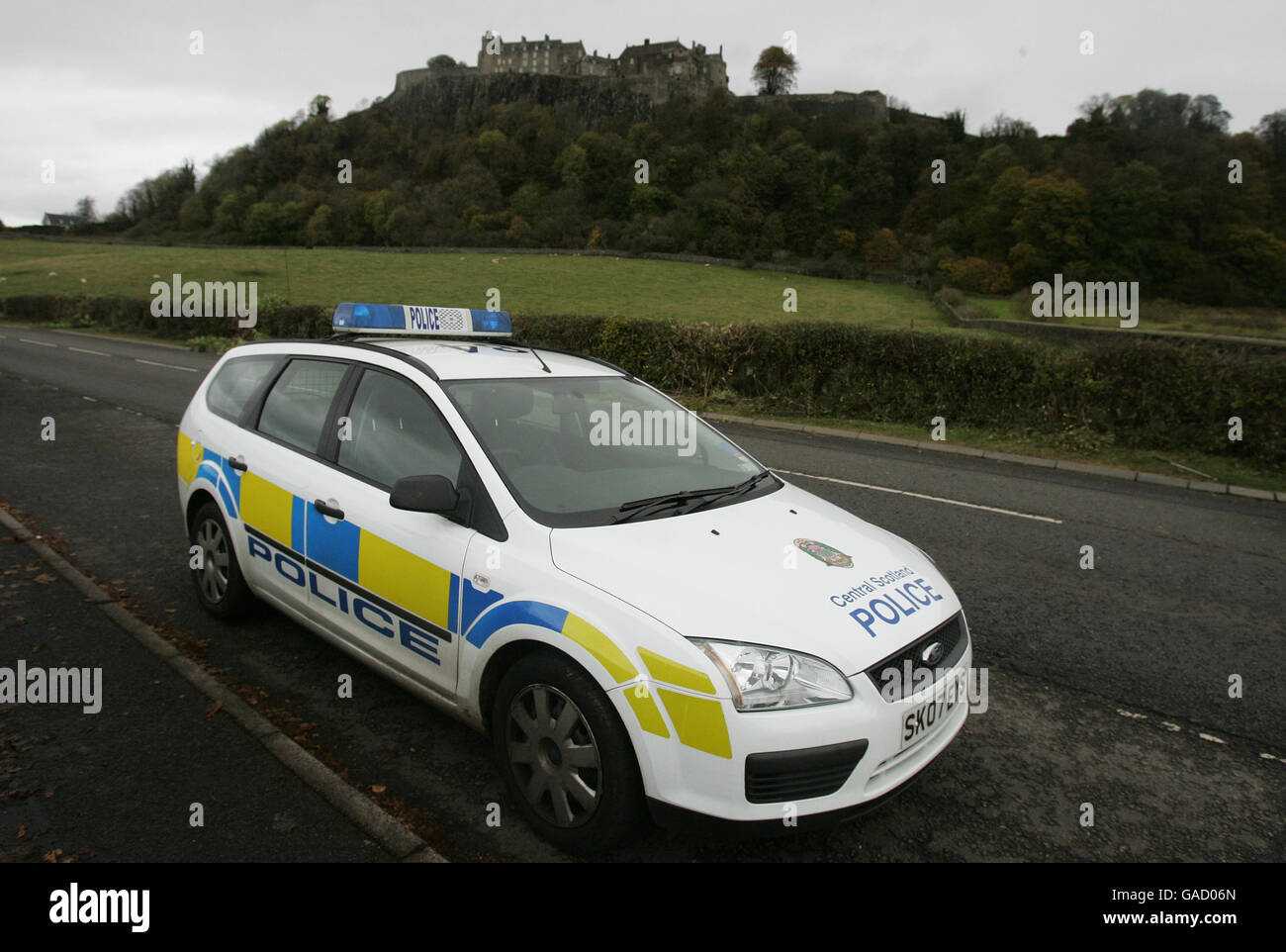 Central scotland police officer beside police car at stirling castle hi ...