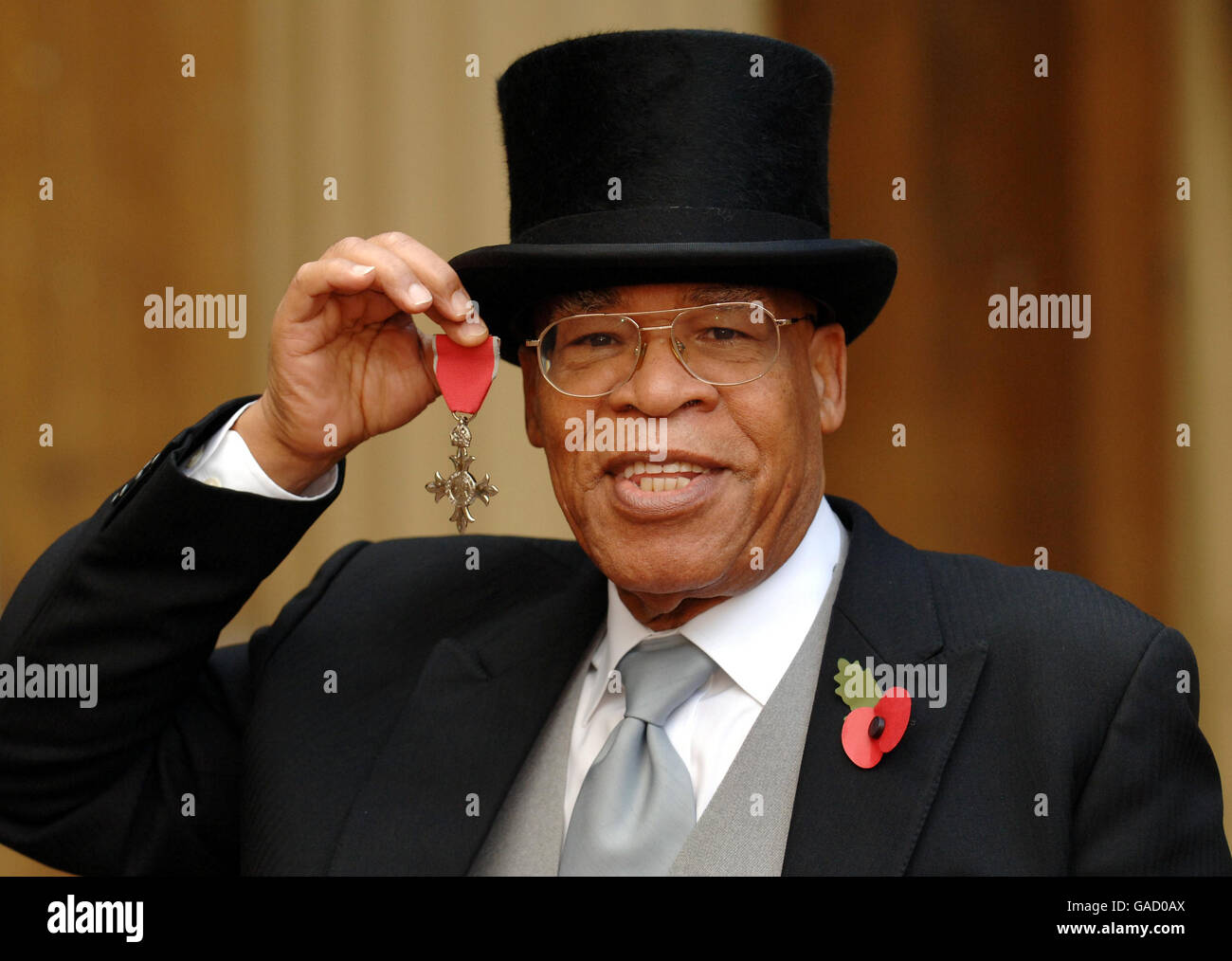 Ian Charles, organiser of the Leeds Carnival, after collecting his MBE ...